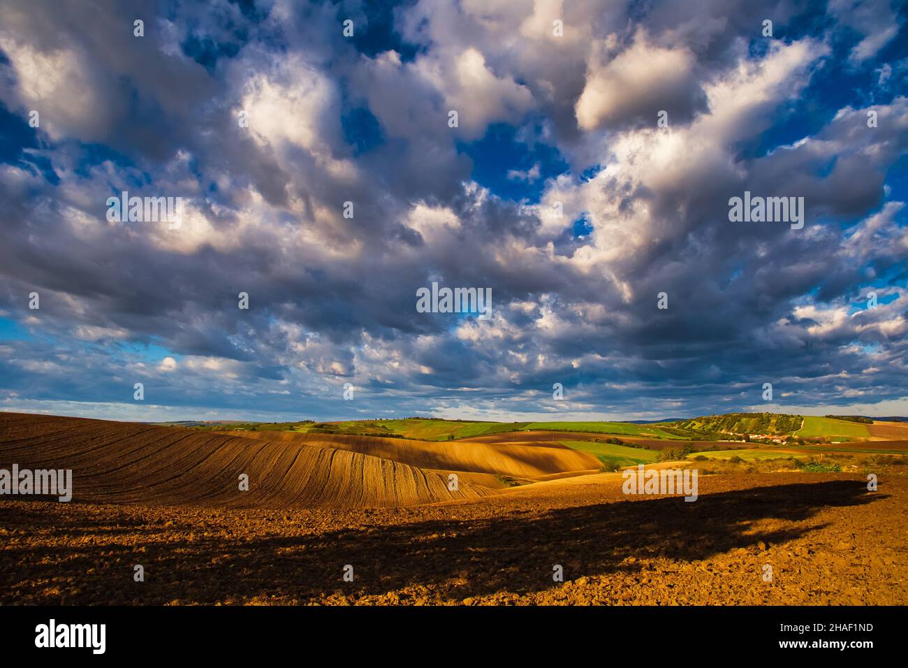 Rolling fields of South Moravia in the autumn morning with a sky full ...