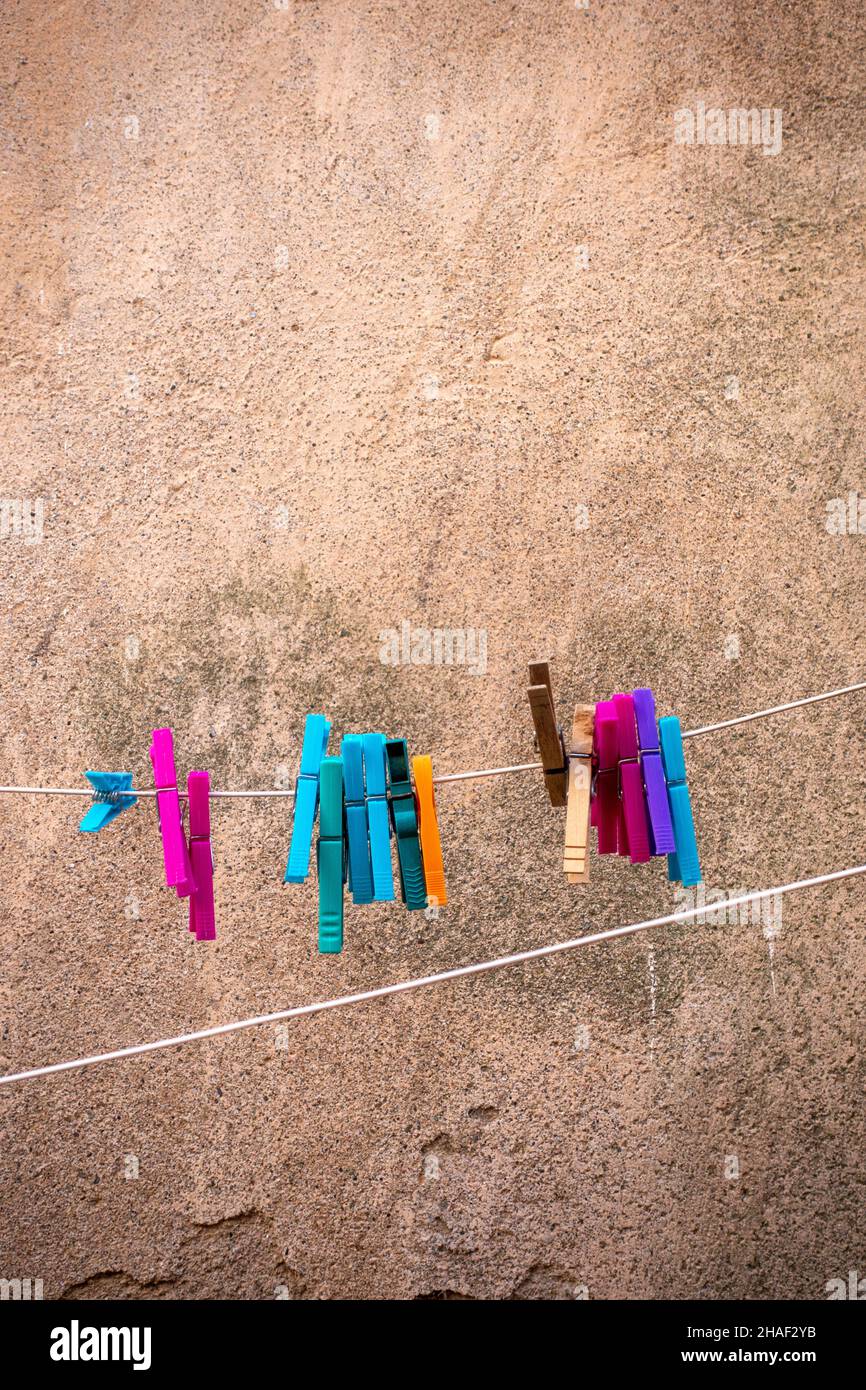 coloured pegs on a washing line Stock Photo - Alamy