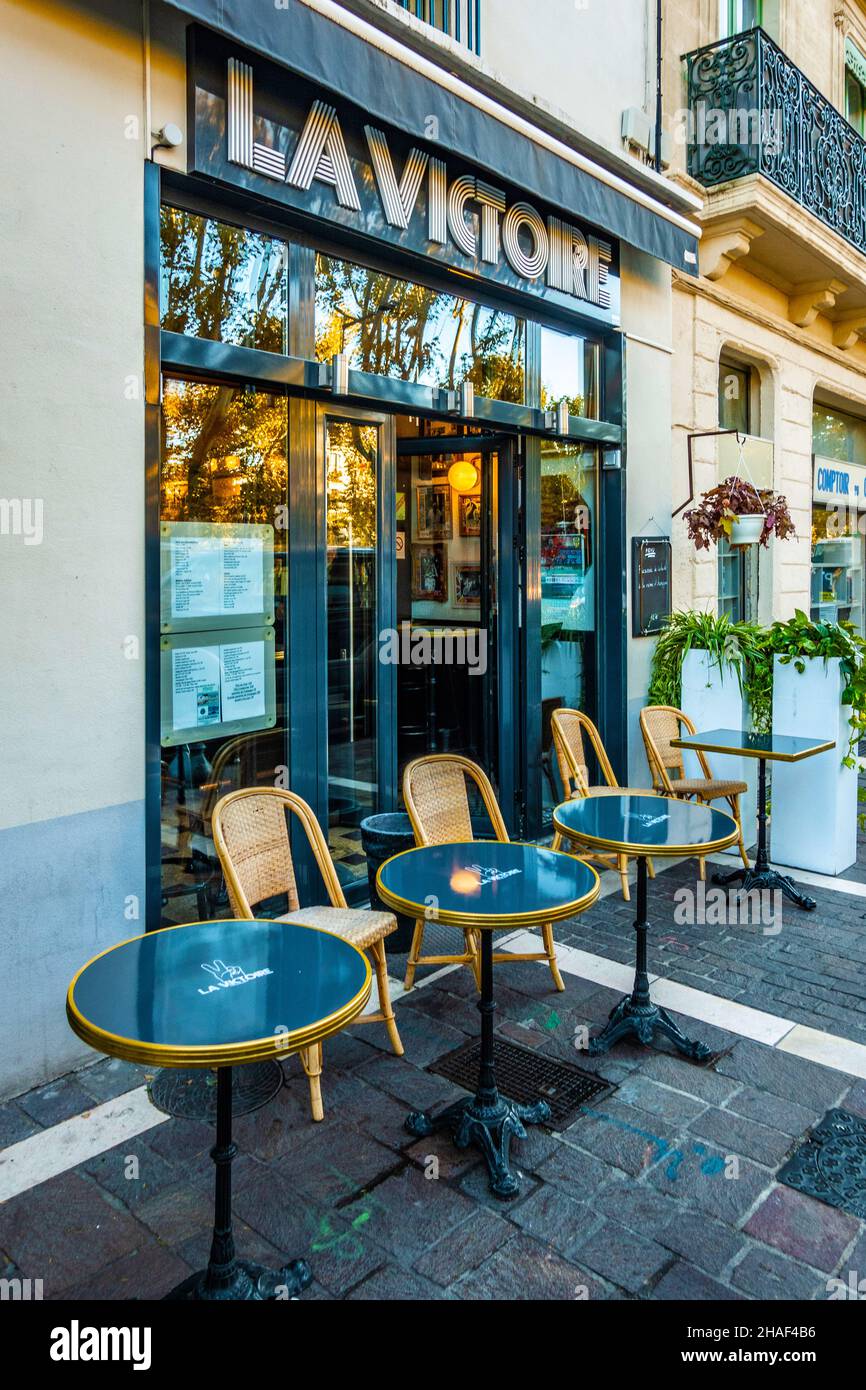 small street cafe with seating outside in Beziers, France Stock Photo ...