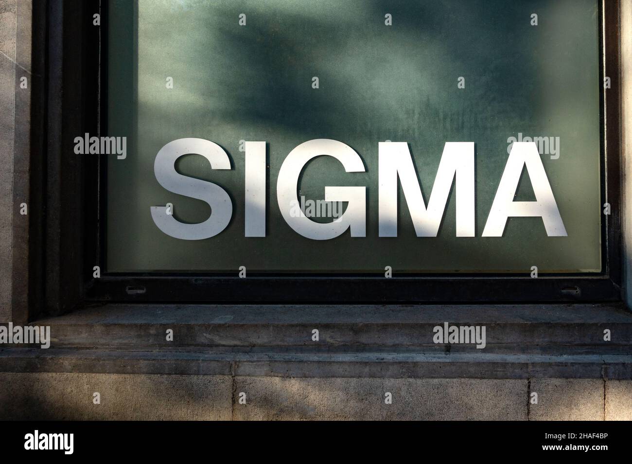 The word Sigma on a sign in an empty office window in Beziers, France ...