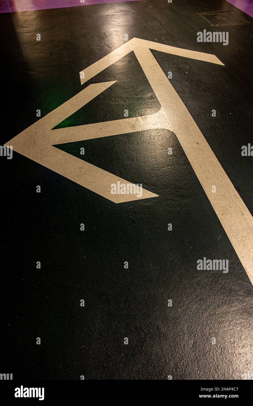 Arrow Signs On A Car Park Floor Showing Two Choices High Resolution ...