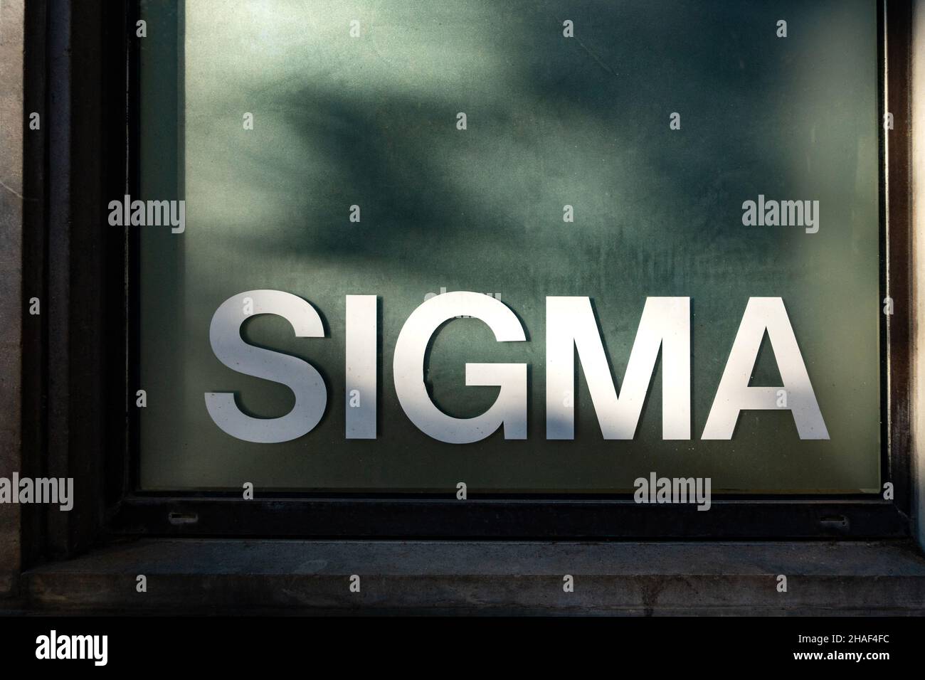 The word Sigma on a sign in an empty office window in Beziers, France ...