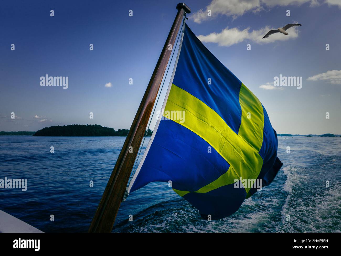 The fflag of Sweden on a boat in the archipelago of Stckholm Stock ...