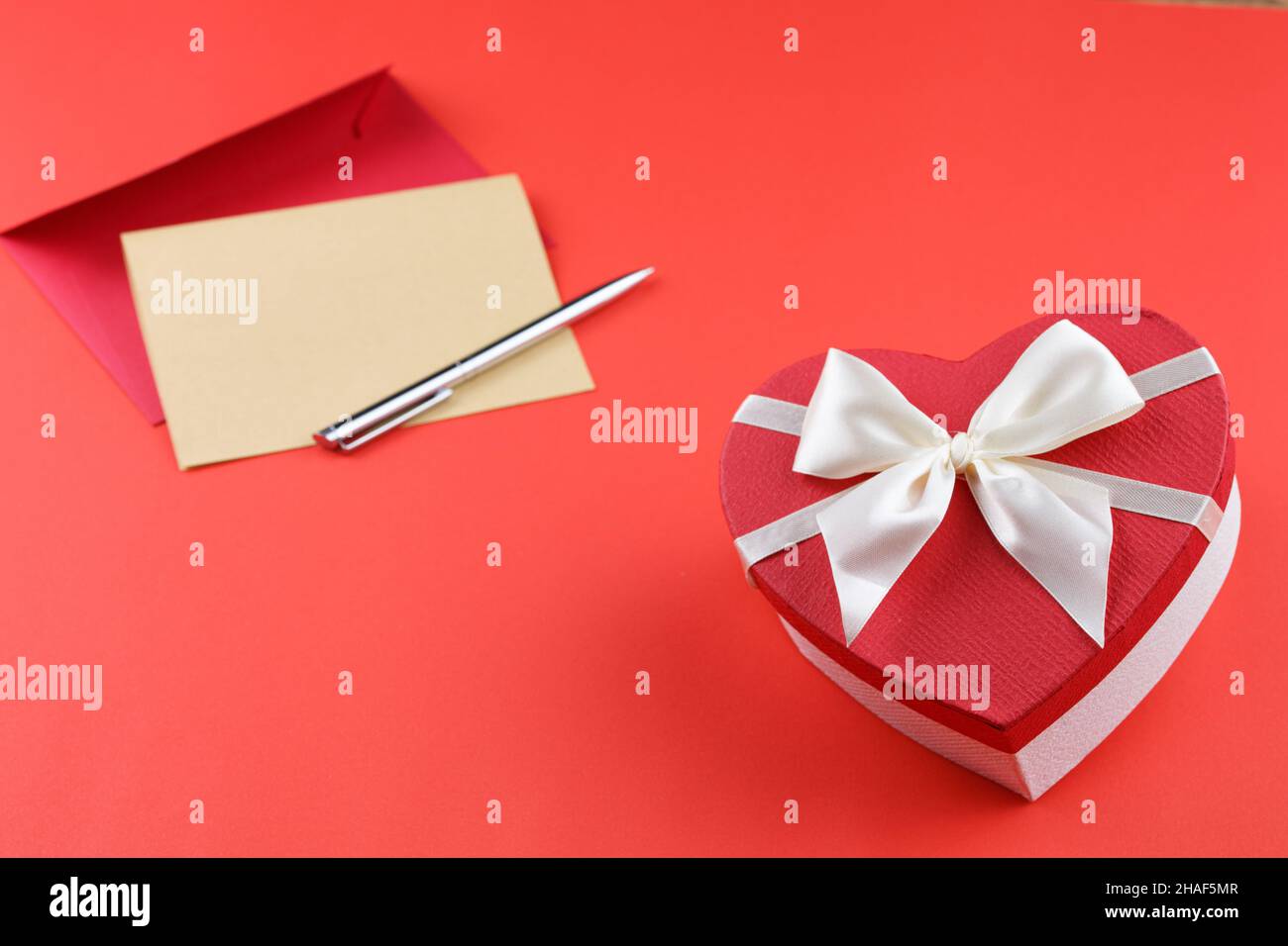 Gifts in colored paper with bows and paper sheet Stock Photo - Alamy