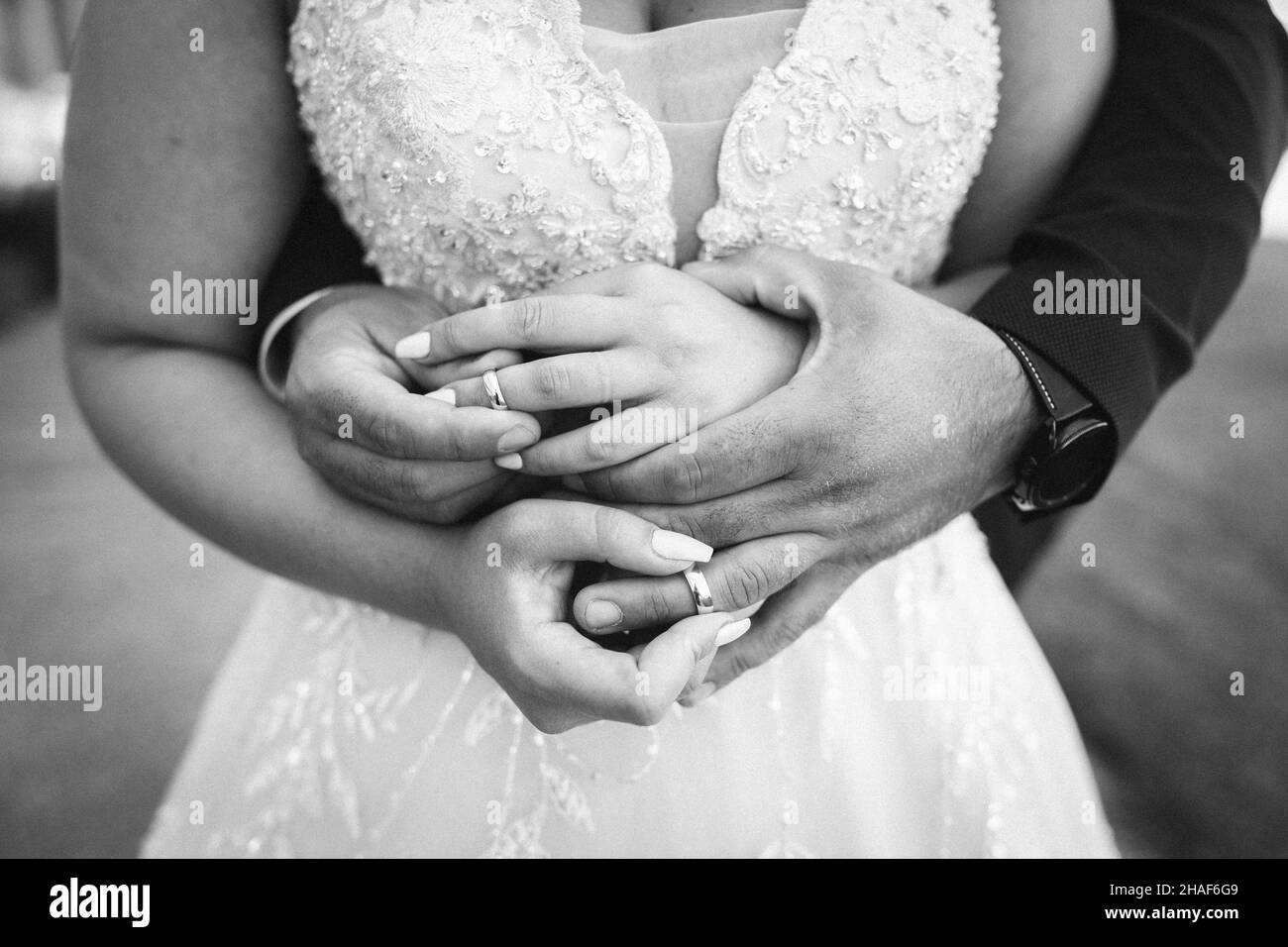 A groom hugging the bride from the back - wedding ceremony photoshoot ...