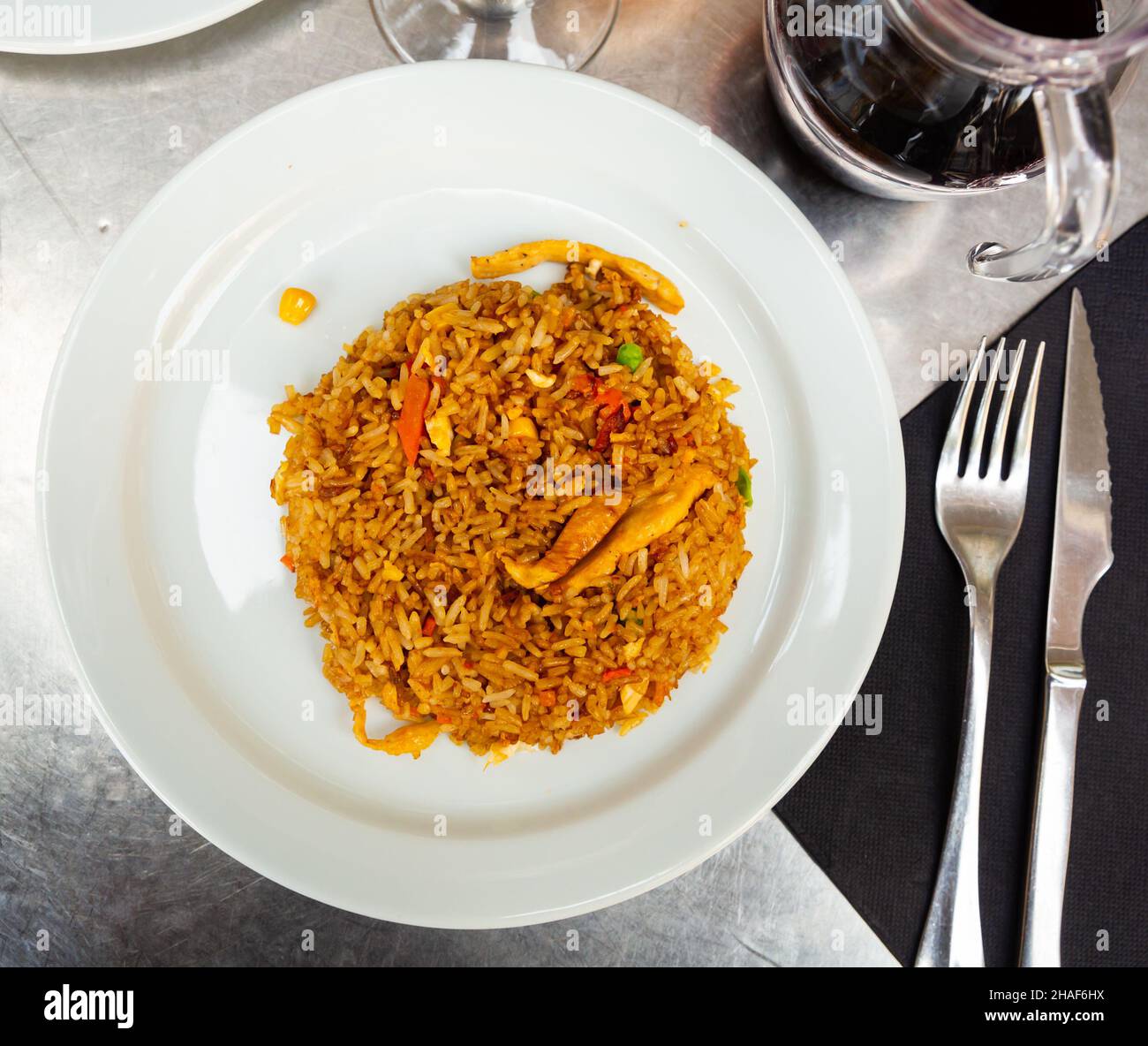 Spanish dish Arroz frito con pollo, fried rice with chicken Stock Photo ...