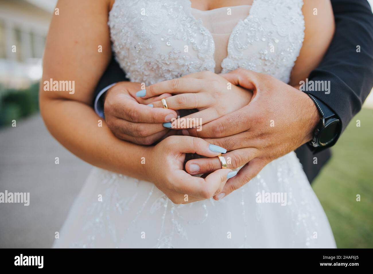 A groom hugging the bride from the back - wedding ceremony photoshoot ...