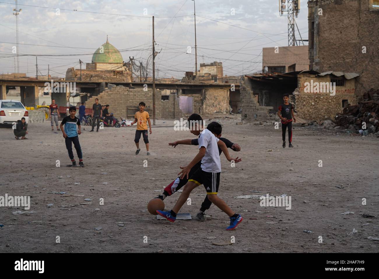 Children playing football in iraq hi-res stock photography and images ...