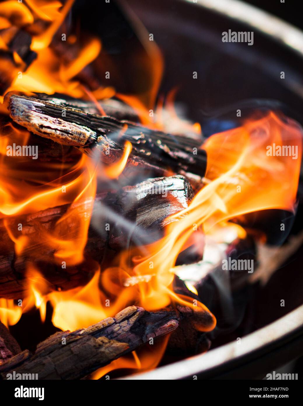 A pile of wood sticks burning Stock Photo - Alamy