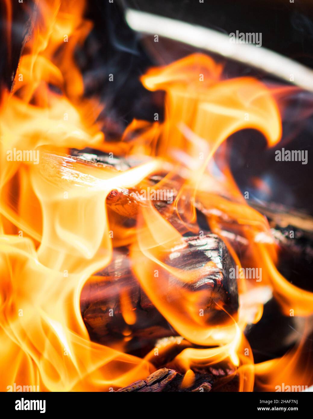 A pile of wood sticks burning Stock Photo - Alamy