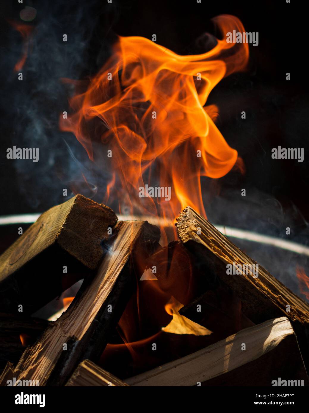 A pile of wood sticks burning Stock Photo - Alamy