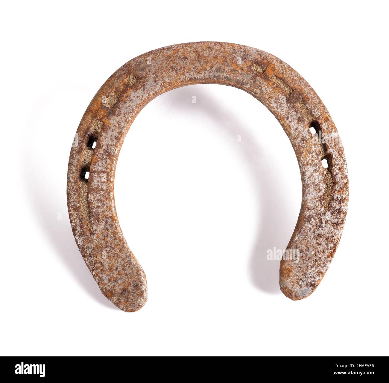 Rusty horseshoe isolated on white background Stock Photo - Alamy
