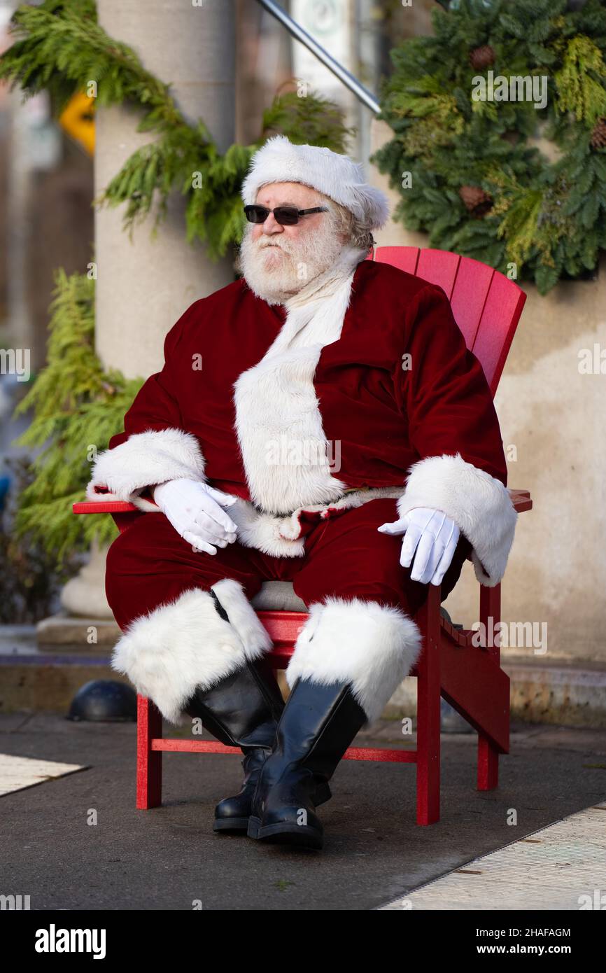 A super cool Santa kicks back in a Muskoka chair at a Christmas event ...