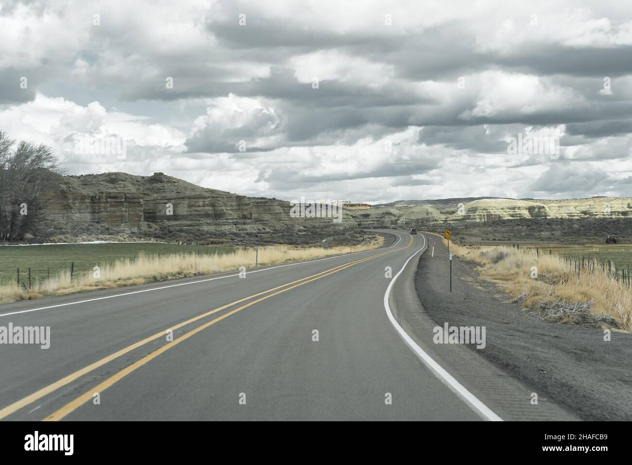 The U.S. 95 asphalt highway in Nevada under a gray sky with large ...