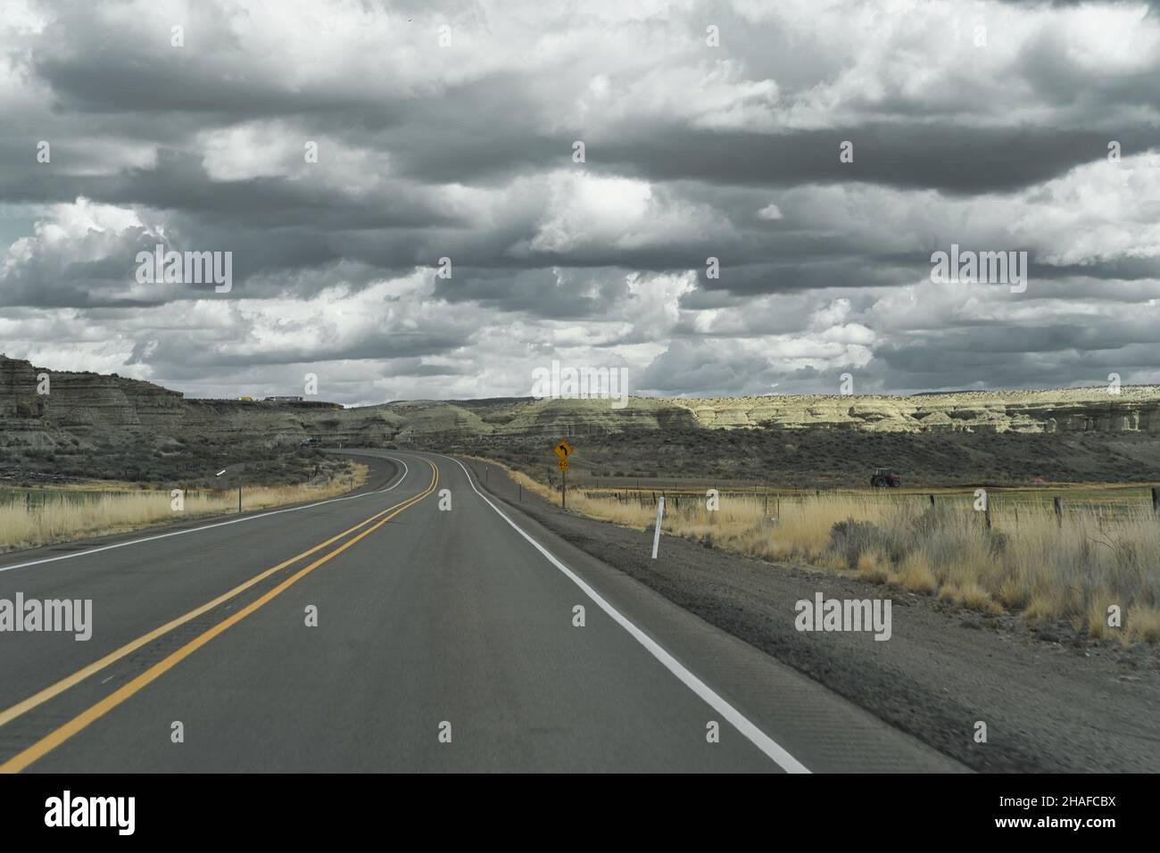 The U.S 95 asphalt highway in Nevada under a gray sky with large ...