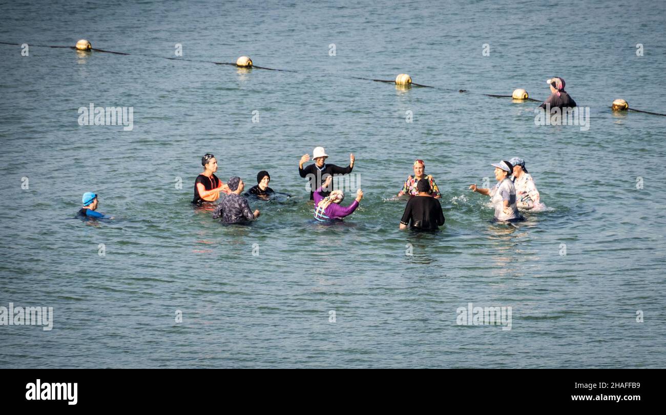 A group of women enjoy bathing at a gender segregated beach in Tel Aviv ...