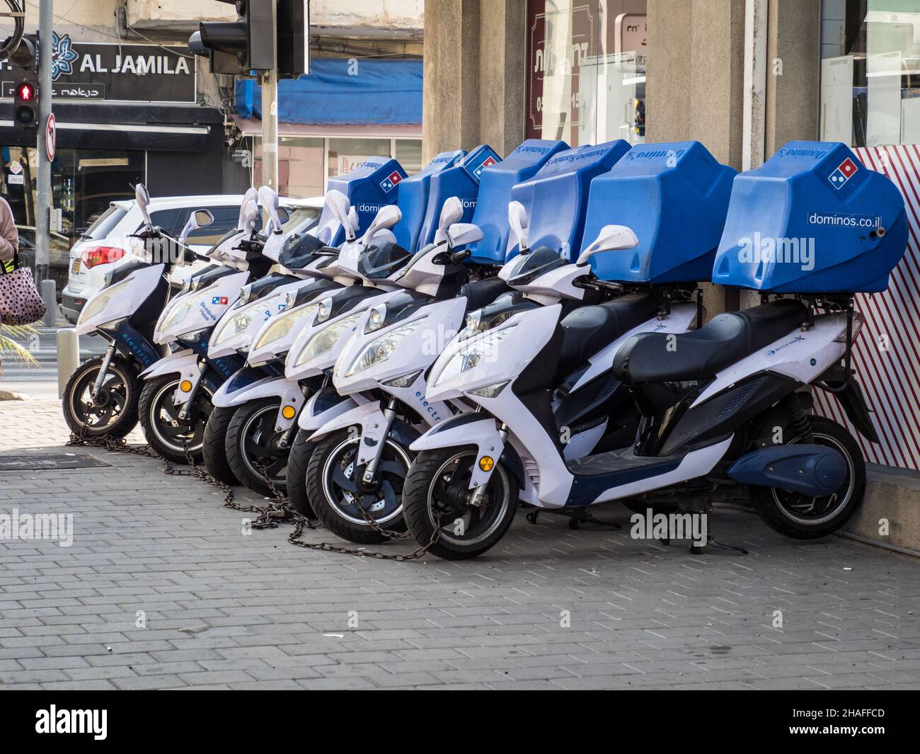 Line of home delivery motorcycles outside a pizza store in Tel Aviv ...