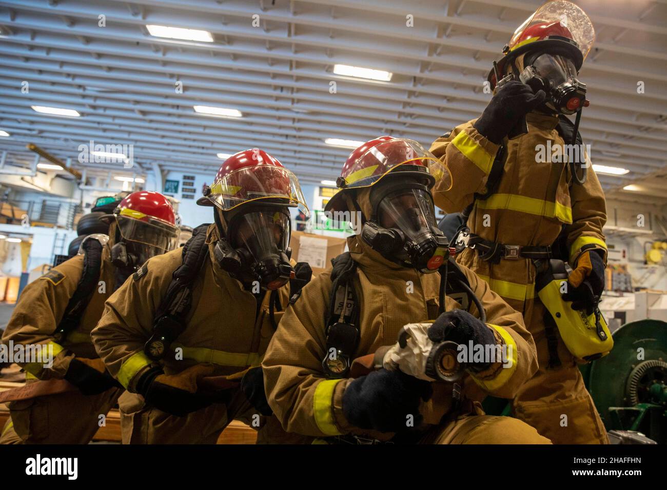 PACIFIC OCEAN (Dec. 11, 2021) – Sailors simulate fighting a fire in the ...