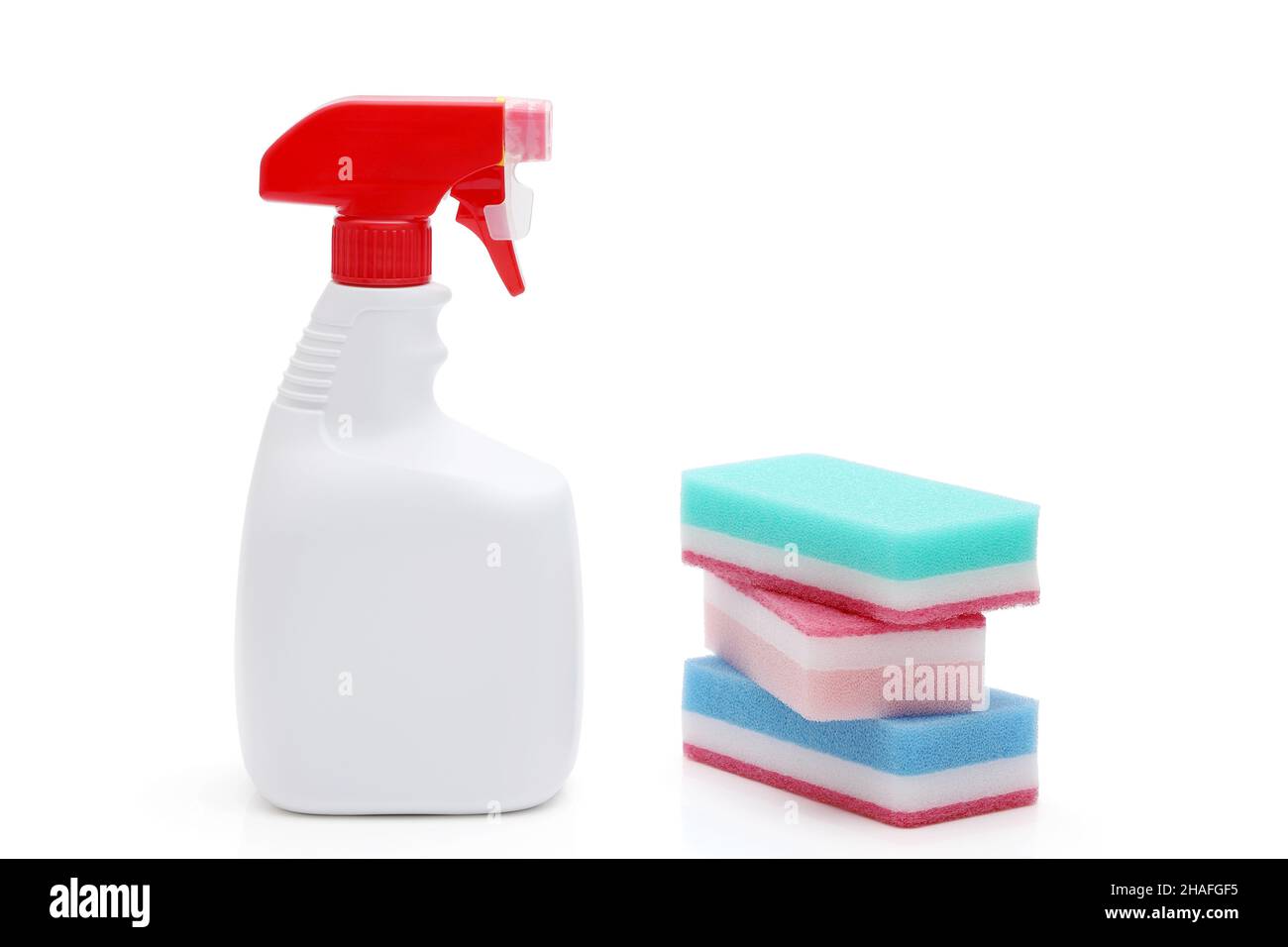 Spray plastic bottle and cleaning sponge on a white background Stock ...