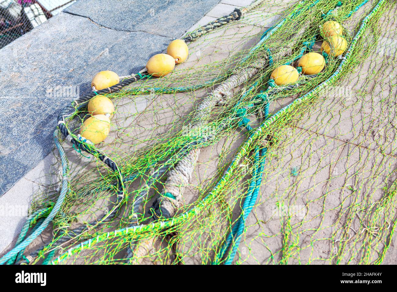 Fishing net with floats on the rope . Fishing industry tools Stock ...