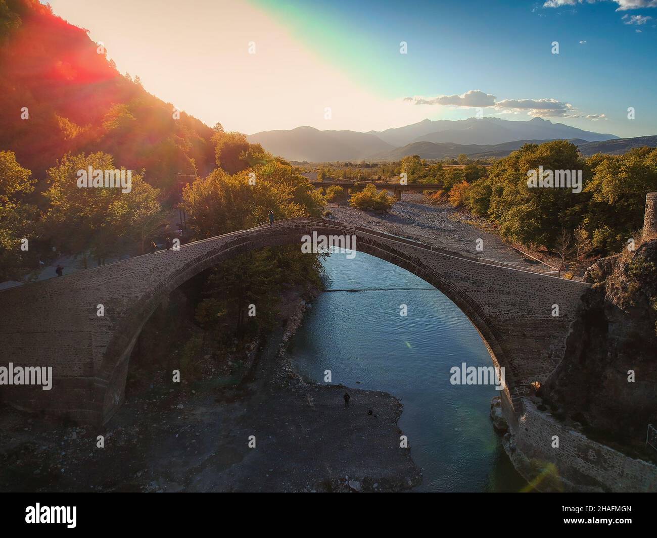 The famous old stoned bridge of Konitsa over Aoos river. Tymfi mount ...
