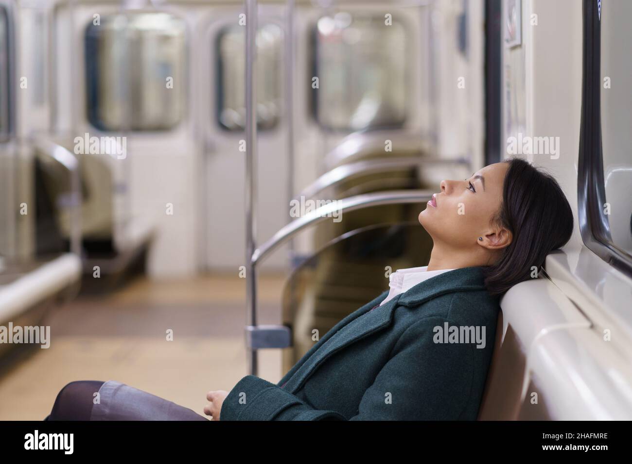 Tired african american businesswoman in subway train, afro female ...