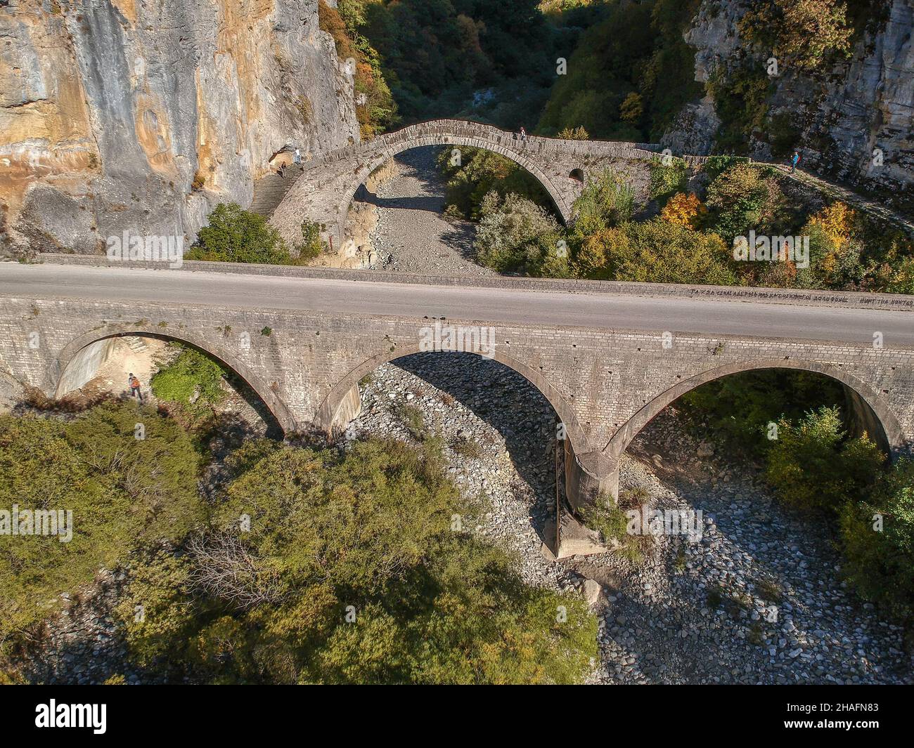 The beautiful old stone bridge known as Kokkoris or Noutsios bridge ...