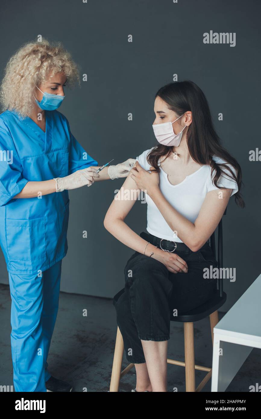 Doctor using a syringe to put a shot of drug as treatment. Medical ...