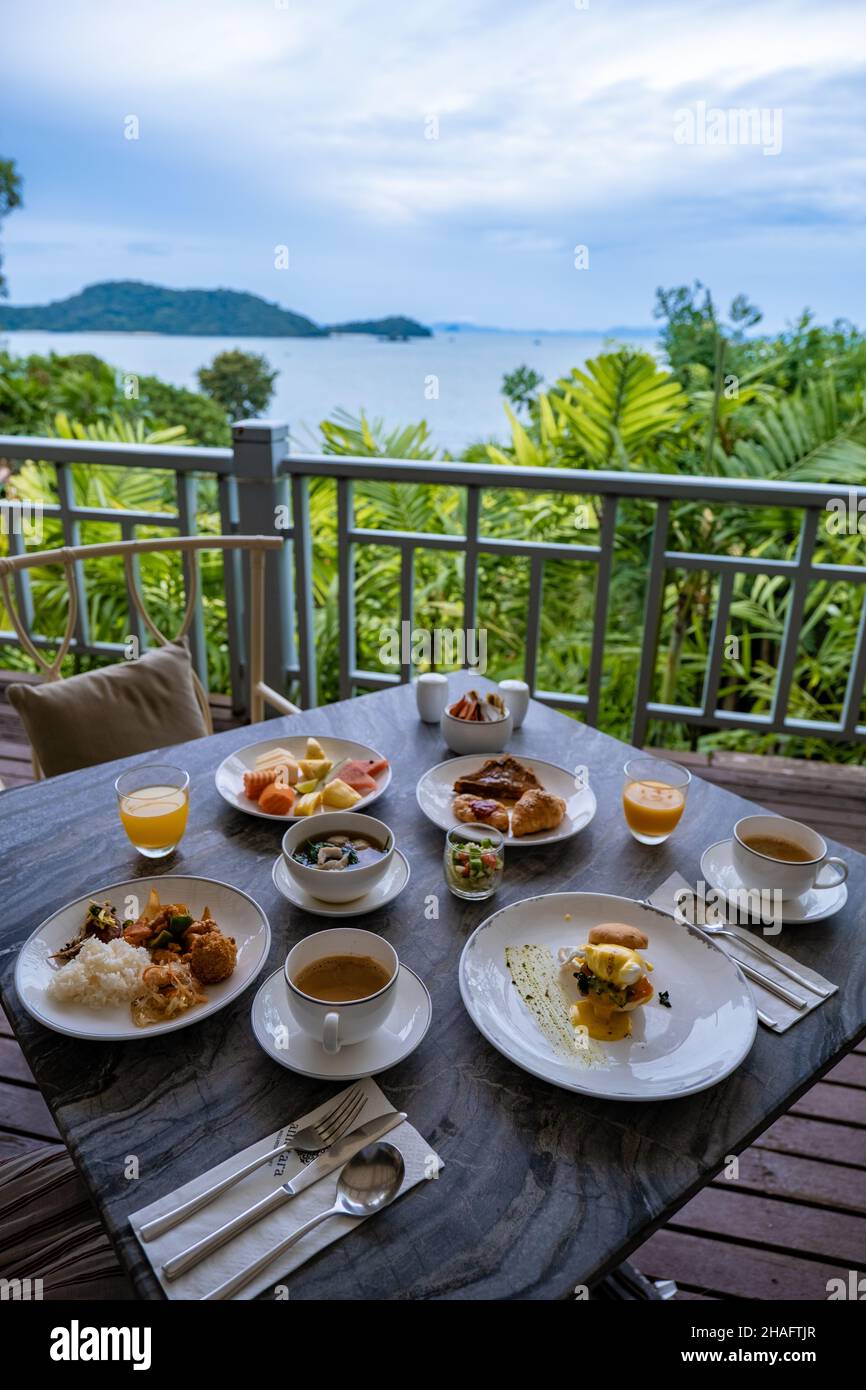 Breakfast table looking out over the ocean, breakfast with coffee bread ...