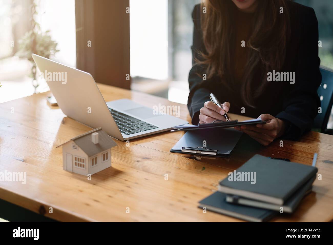 Real estate woman working for business financial from paperwork ...