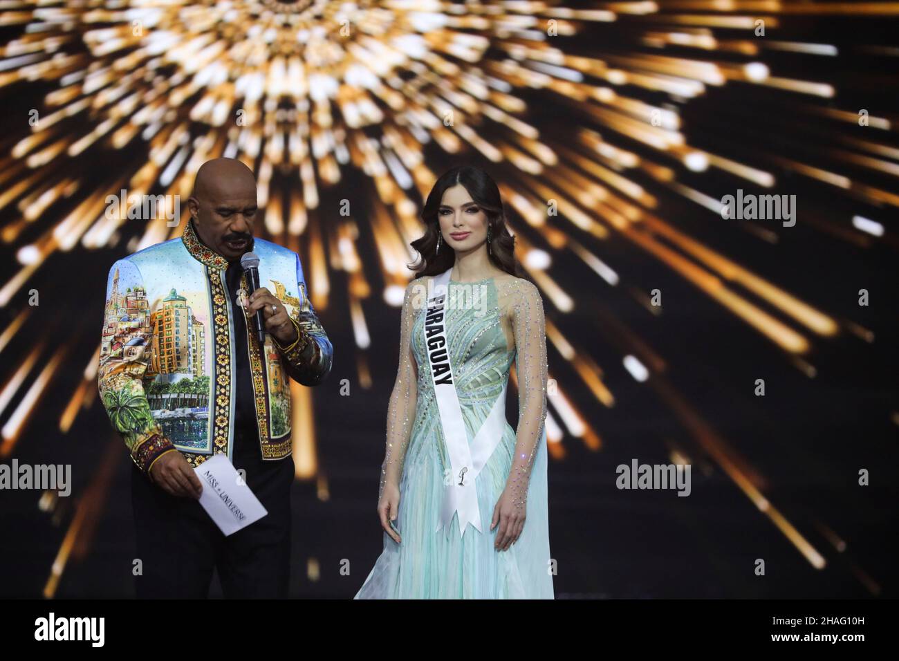 Eilat, Israel. 13th Dec, 2021. Host Steve Harvey (L) speaks with Miss ...