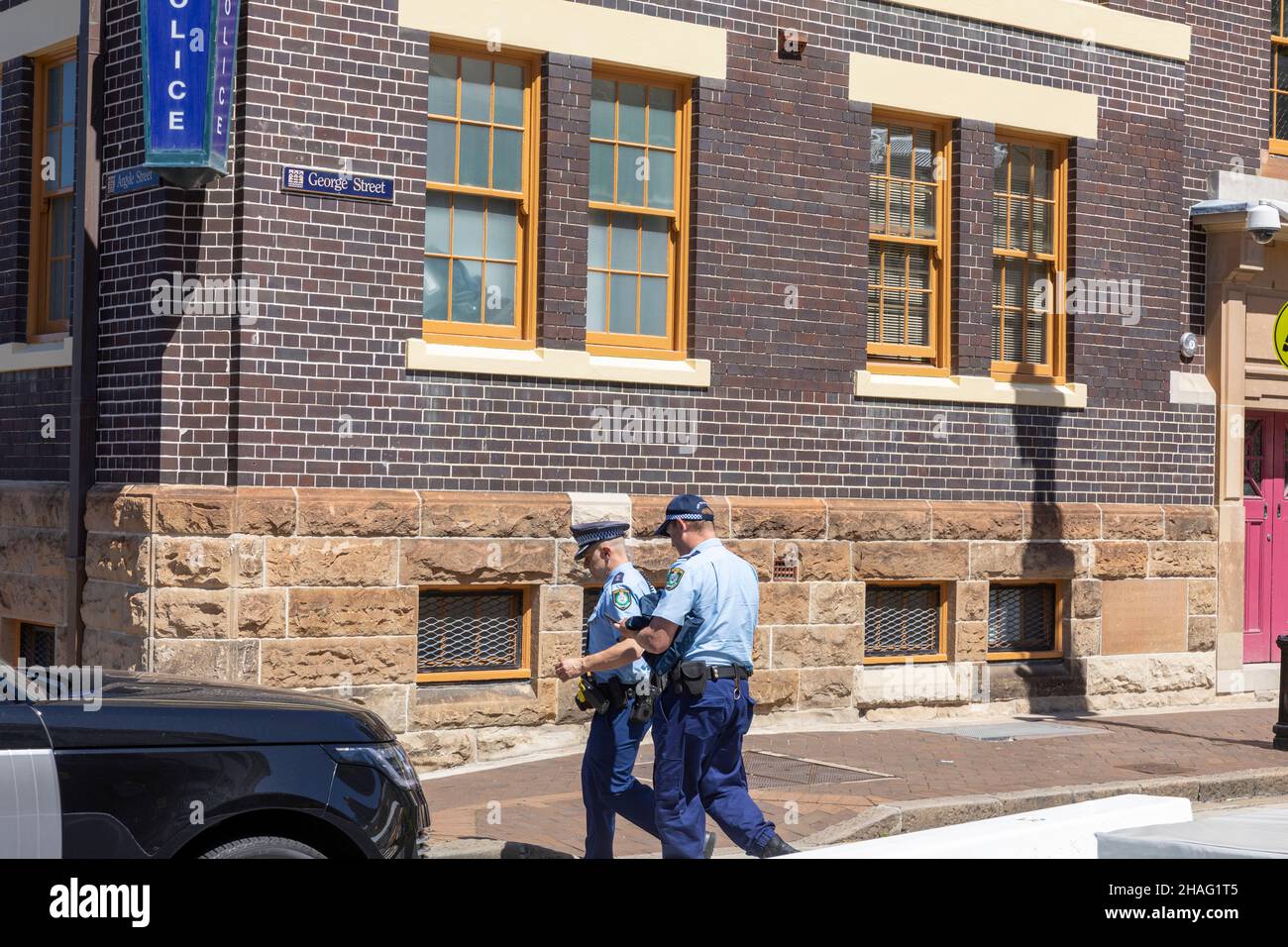 Two Sydney police officers from the NSW Police force walk past The ...