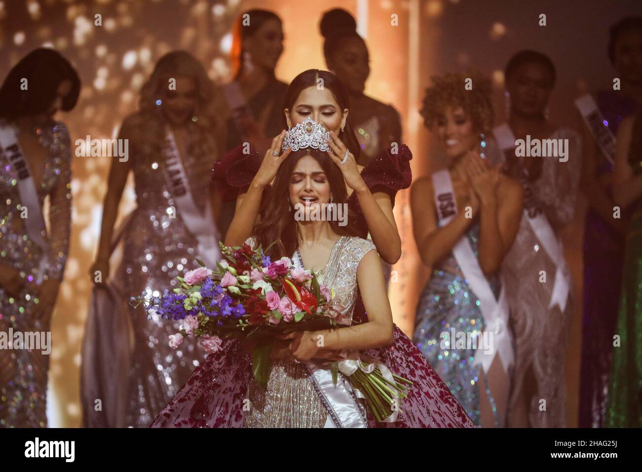 Eilat, Israel. 13th Dec, 2021. Miss India Harnaaz Sandhu reacts as she ...