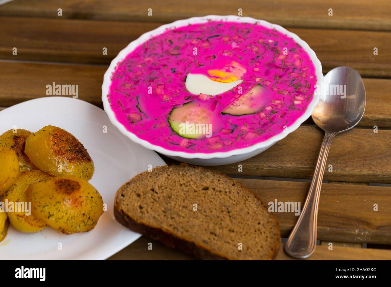 Traditional Belarusian cold vegetable soup Holodnik served with baked ...