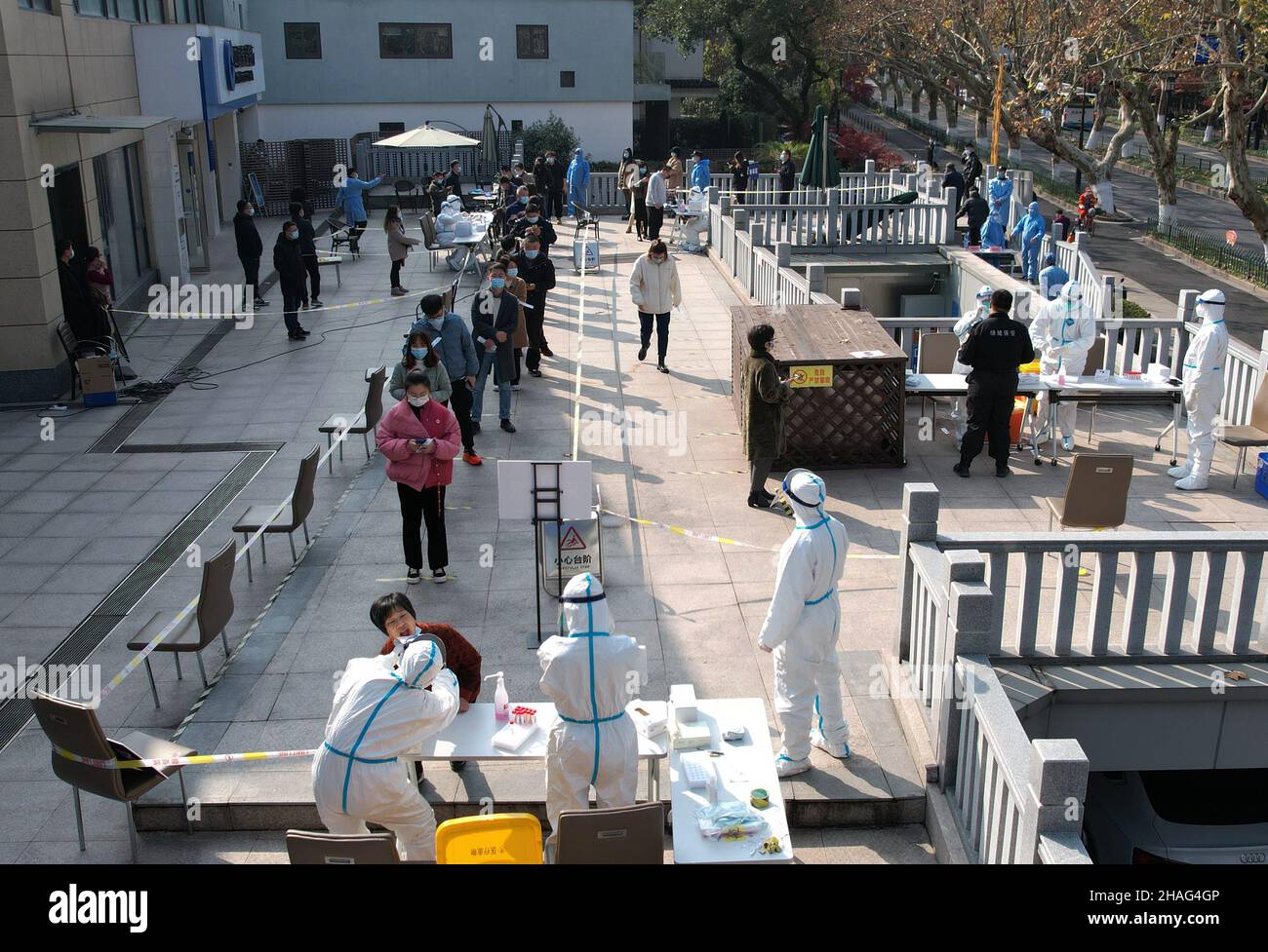 HANGZHOU, CHINA - DECEMBER 13, 2021 - A citizen receives nucleic acid ...