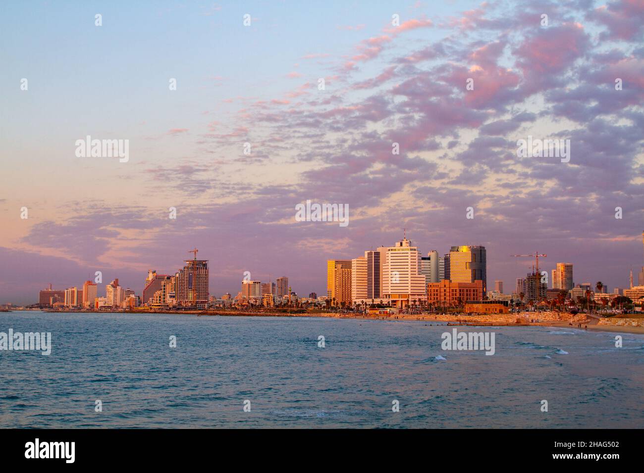 Israel, Tel Aviv coastline as seen from south from Old Jaffa at sunset ...