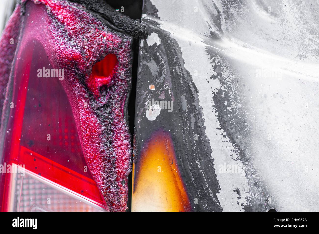 Burned car. abstract close up of the melted parts of a fire damaged ...