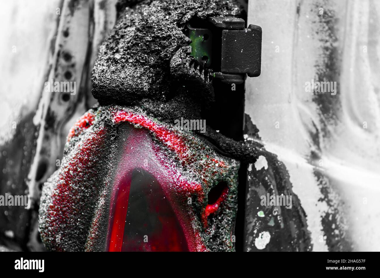 Burned car. abstract close up of the melted parts of a fire damaged ...