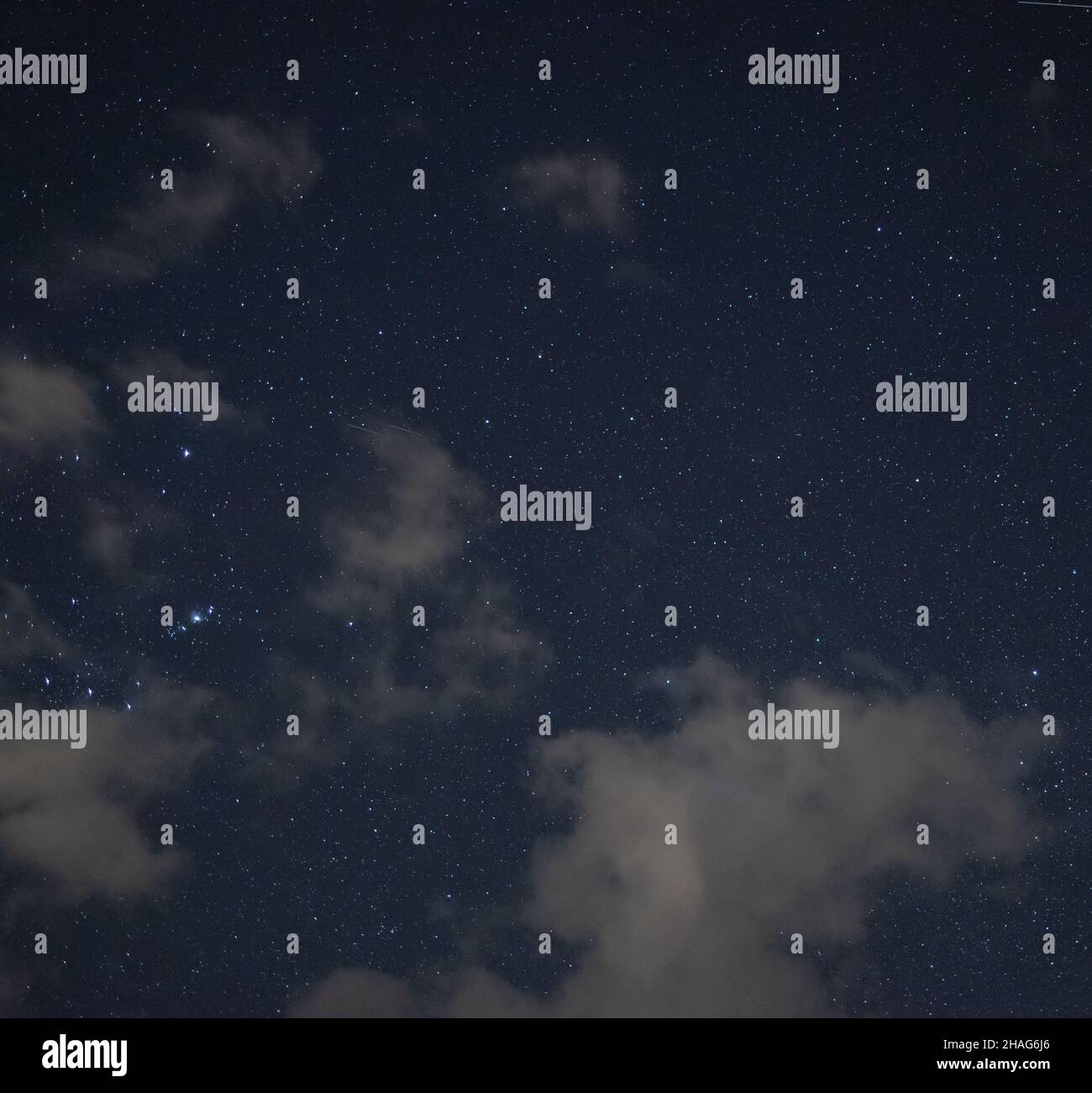 starry night with crisp sky and some clouds with a lot of ...