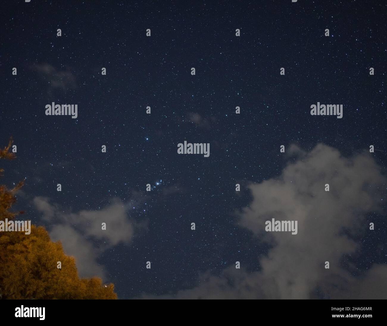 starry night with crisp sky and some clouds with a lot of ...