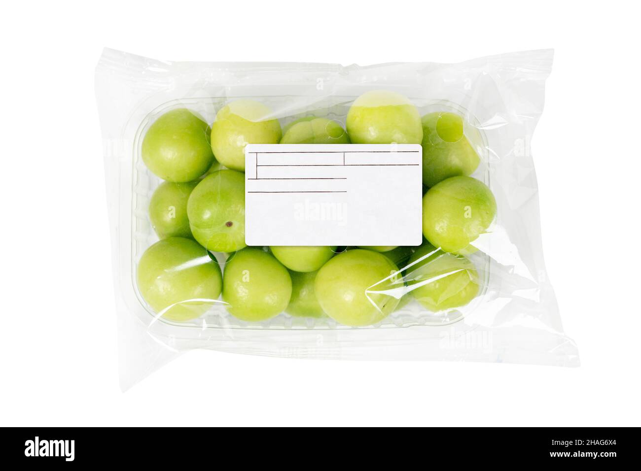 Packaged delicious green plums on a white isolated background Stock ...