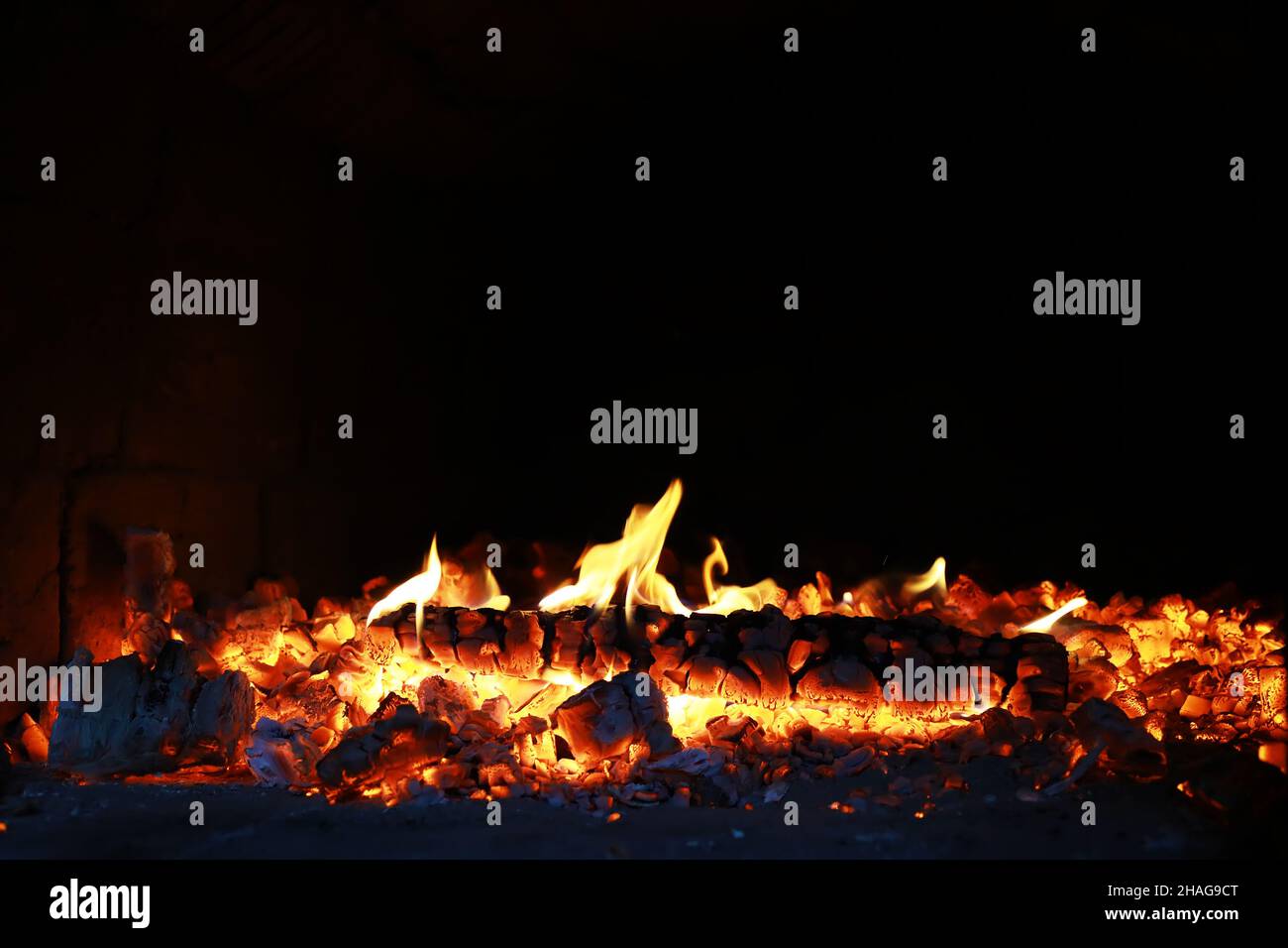 Burning red hot sparks fly from big fire. Beautiful abstract background ...