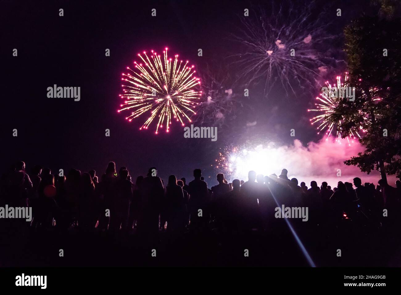 Crowd watching fireworks and celebrating new year eve Stock Photo - Alamy