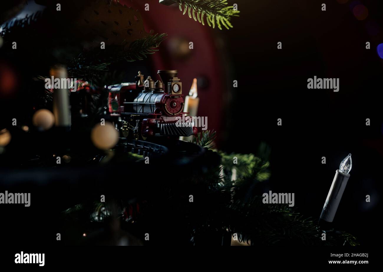 retro christmas train on tree. miniature railway Stock Photo - Alamy