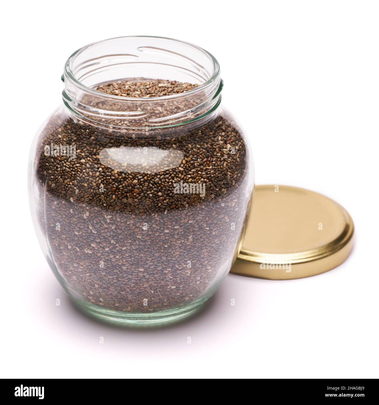 glass can full of organic natural chia seeds close-up isolated on white ...