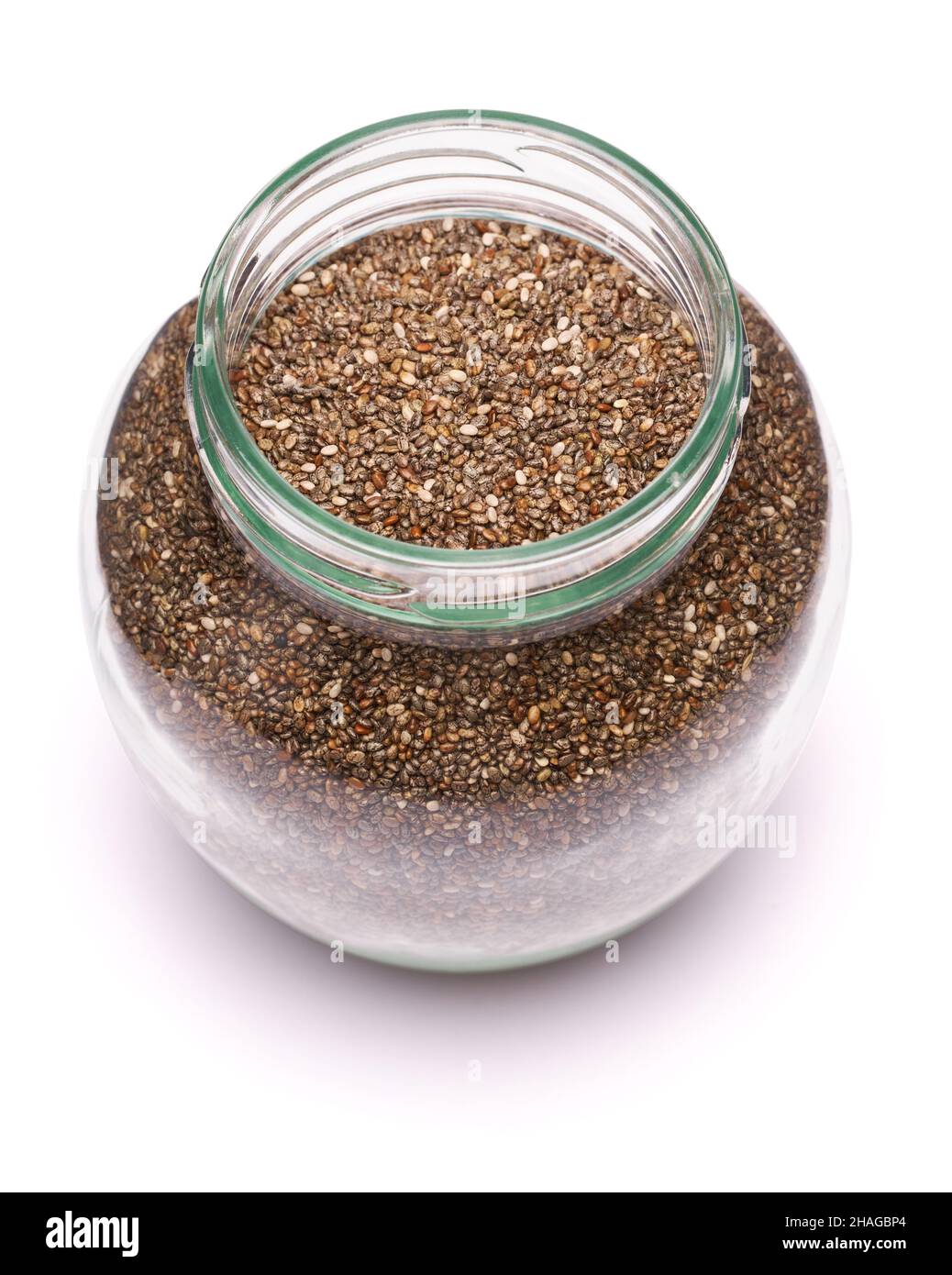 glass can full of organic natural chia seeds close-up isolated on white ...