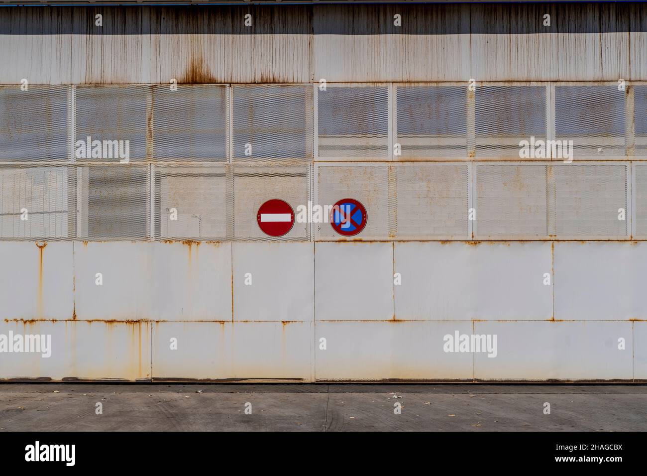 industrial metal door with access prohibition signs Stock Photo - Alamy