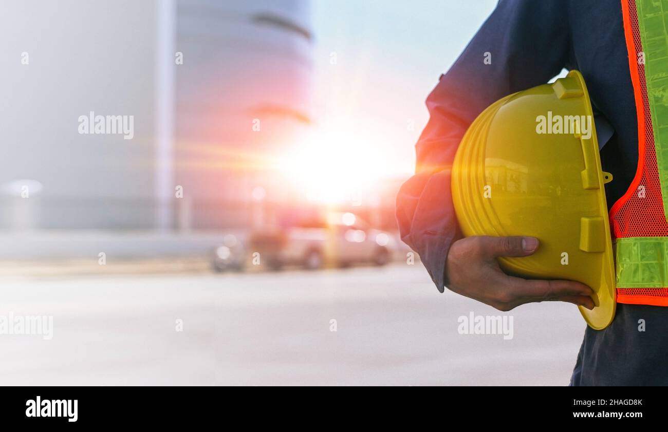 Engineer construction holding hard hat, Technician holding helmet ...