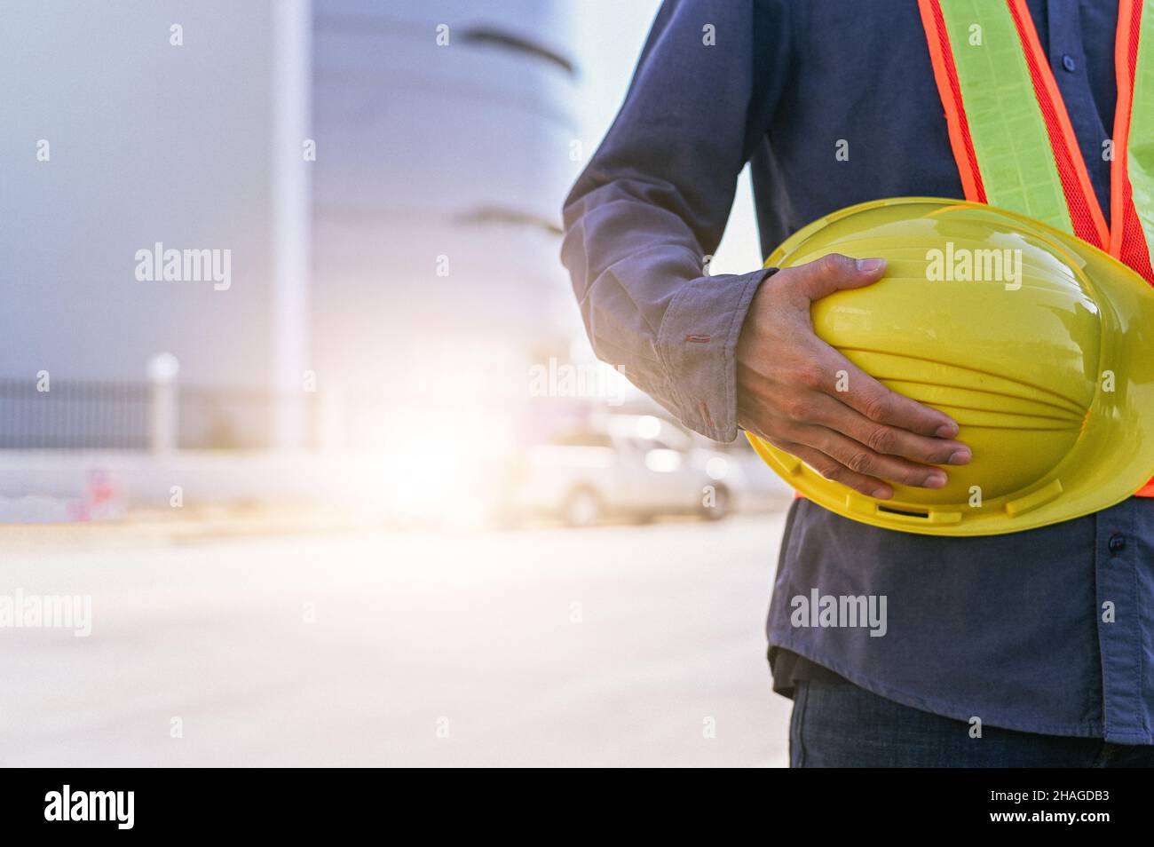 Engineer construction holding hard hat, Technician holding helmet ...