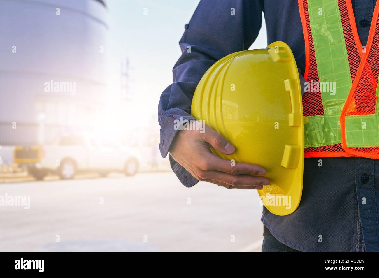 Engineer construction holding hard hat, Technician holding helmet ...